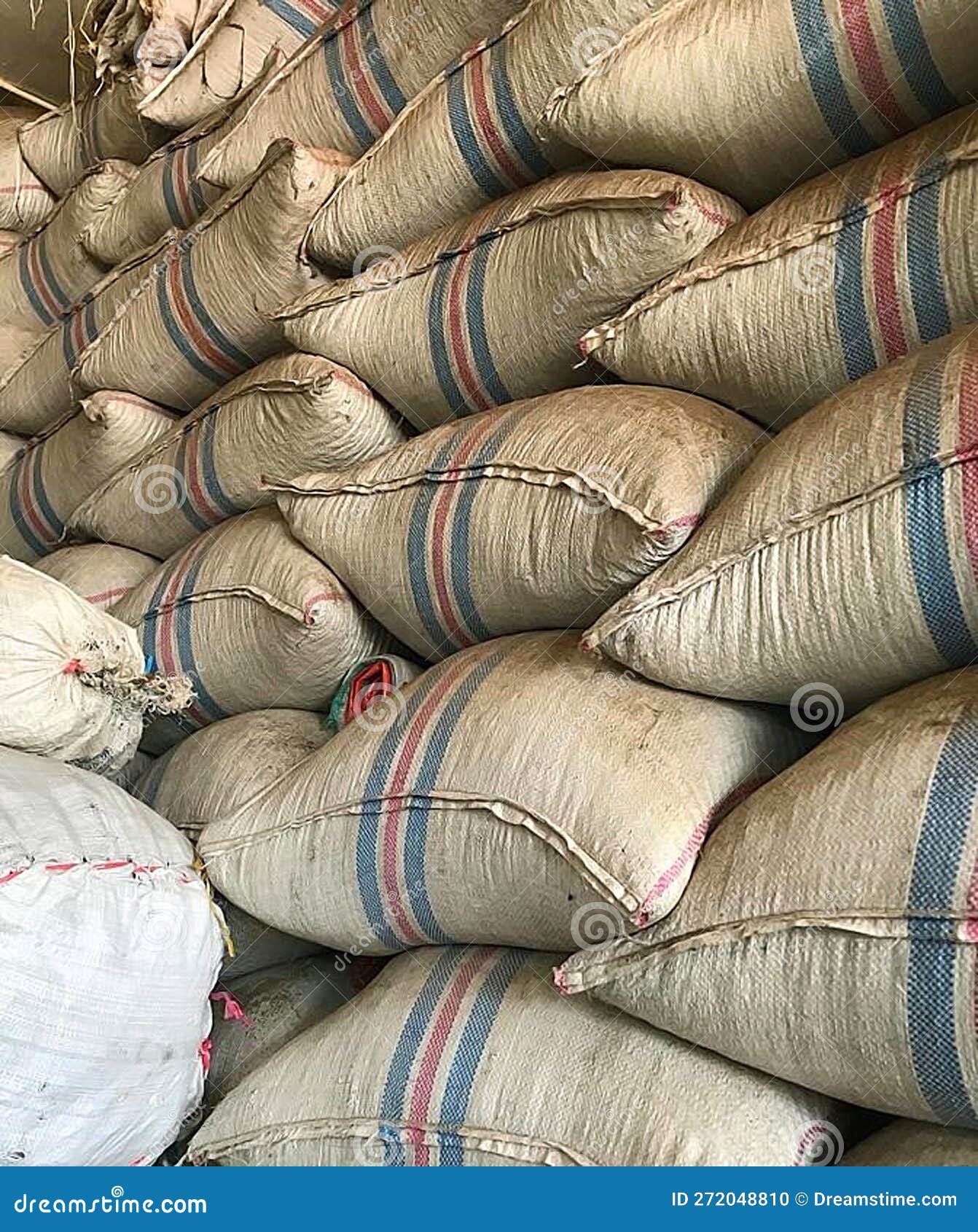 A Tall Pile of Burlap Sacks Located in the Exporter S Warehouse. Stock ...