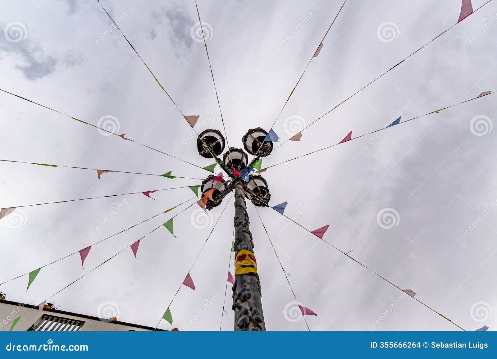 A Tall Pole with Many Flags Hanging from it Stock Photo - Image of ...