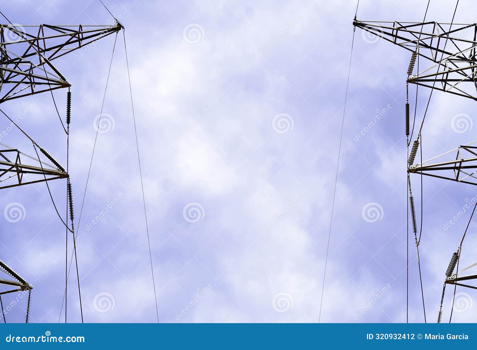 Two Tall Power Towers with a Blue Sky in the Background Stock Photo ...