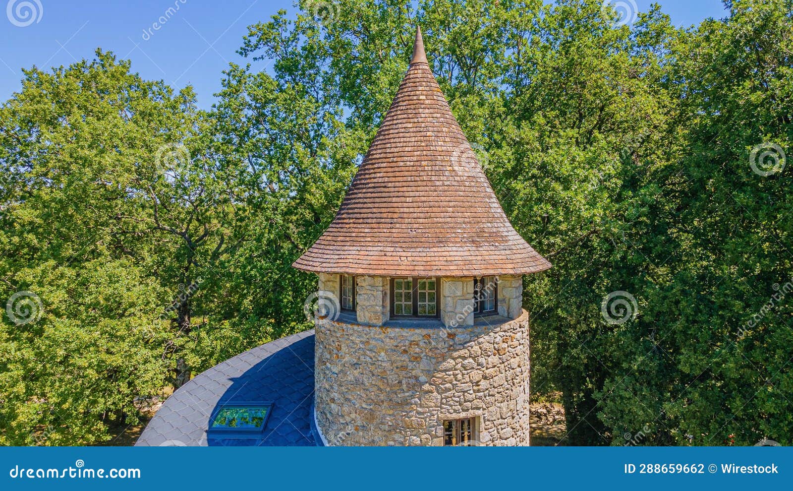 Tall, Rectangular Tower Situated Amongst a Backdrop of Lush Greenery ...