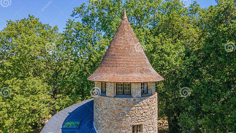 Tall, Rectangular Tower Situated Amongst a Backdrop of Lush Greenery ...