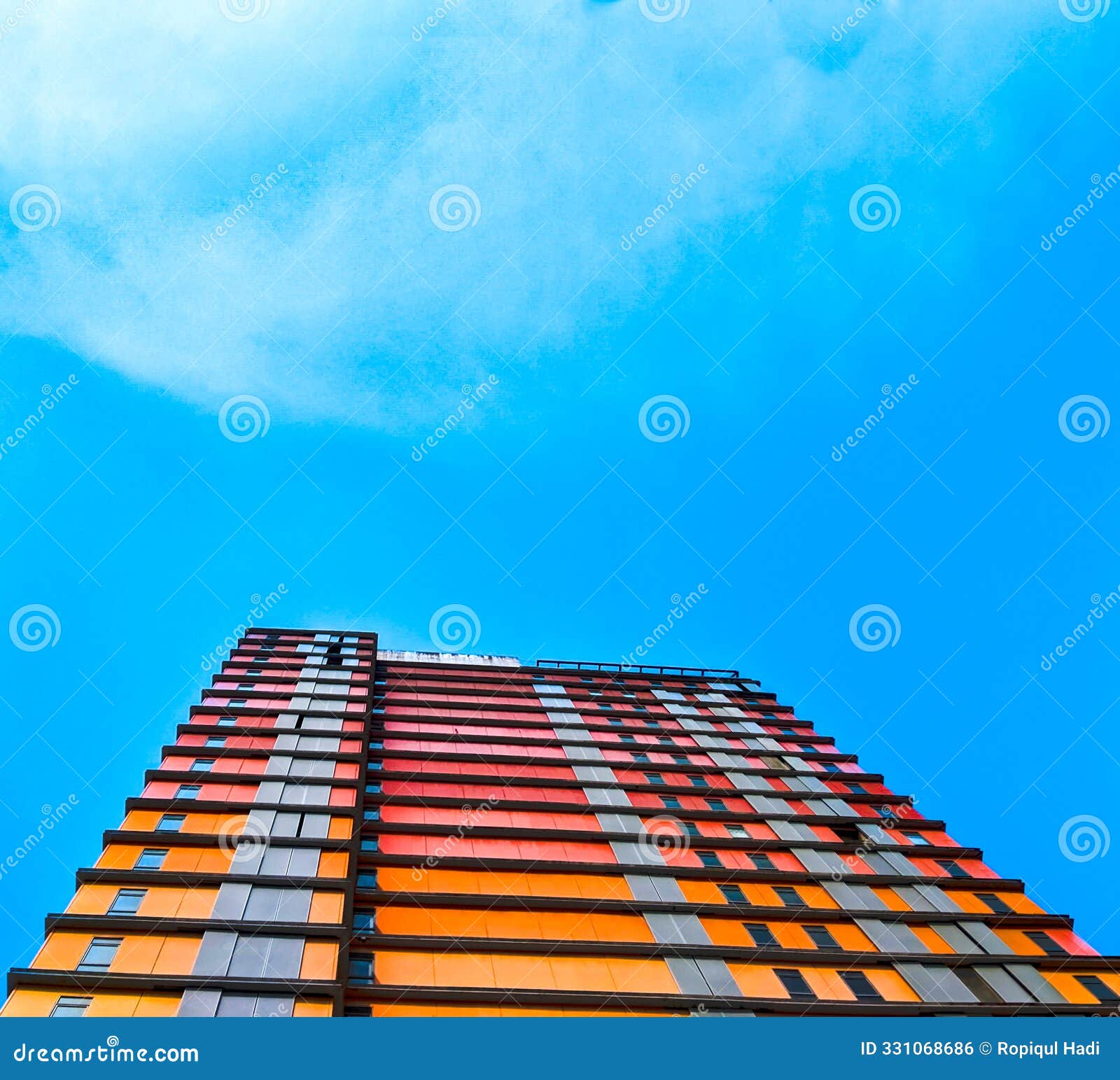 A Tall Red and Orange Building Stock Photo - Image of level, color ...