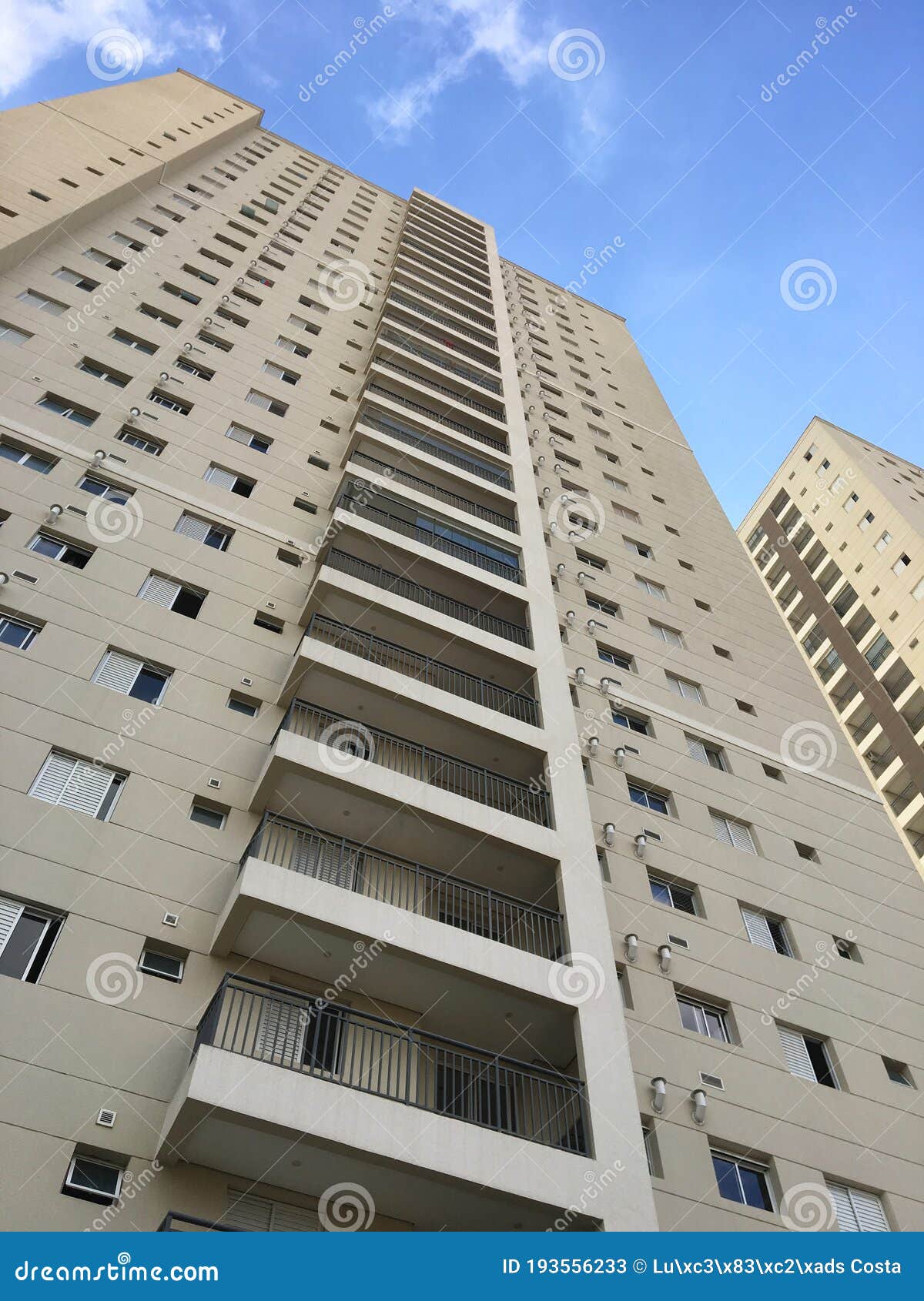 Tall residential building stock image. Image of facade - 193556233