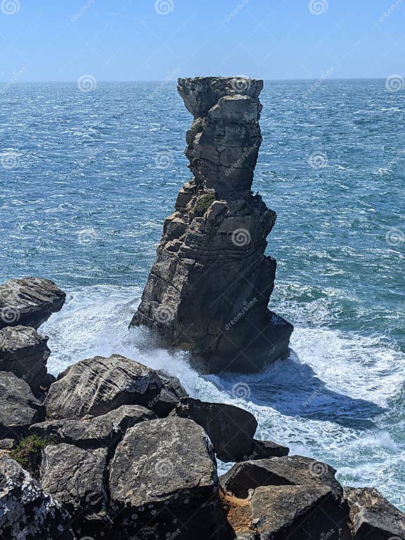 Tall Rock Structure in the Middle of the Ocean Stock Photo - Image of ...