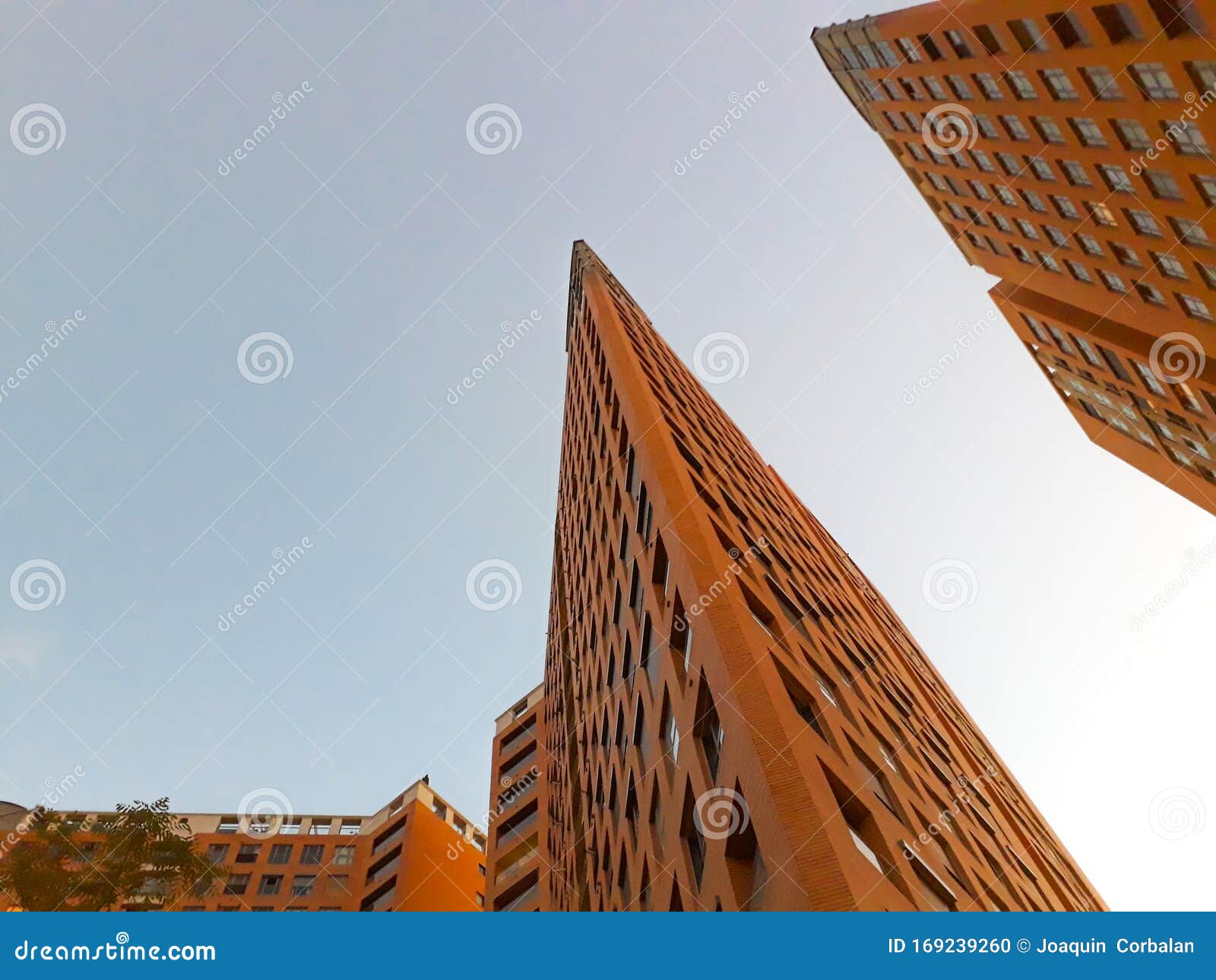 Tall, Sharp Homes, Challenging Brick Buildings with Blue Sky Stock ...
