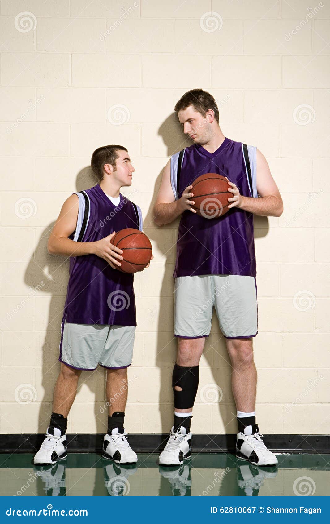 Tall and Short Basketball Players Stock Image - Image of partner ...