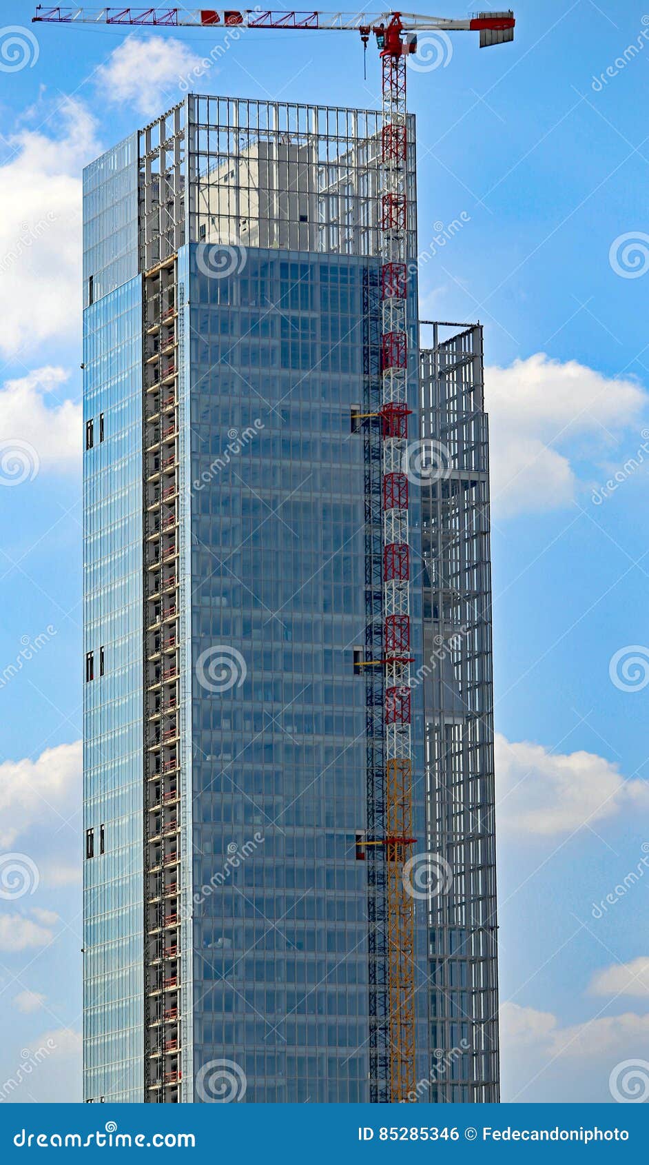 Tall Skyscraper Under Construction Made of Glass and Steel with Stock ...