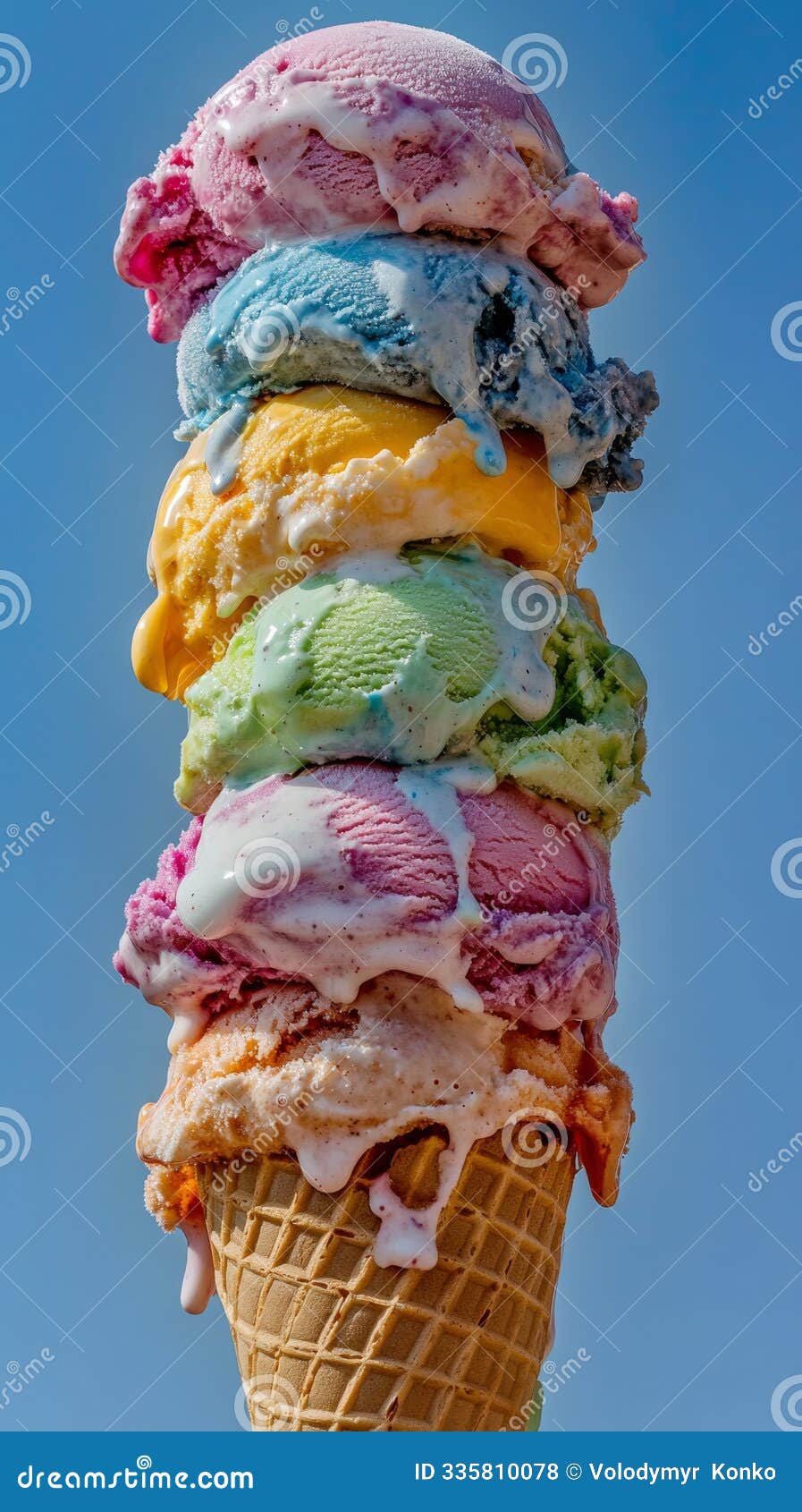 Tall Stack of Colorful Ice Cream Scoops on a Cone Under Blue Sky Stock ...