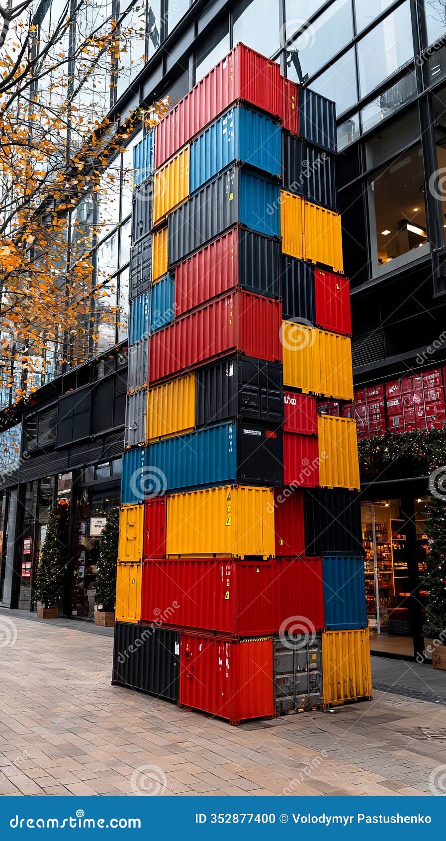 A Tall Stack of Colorful Shipping Containers in Front of a Building ...