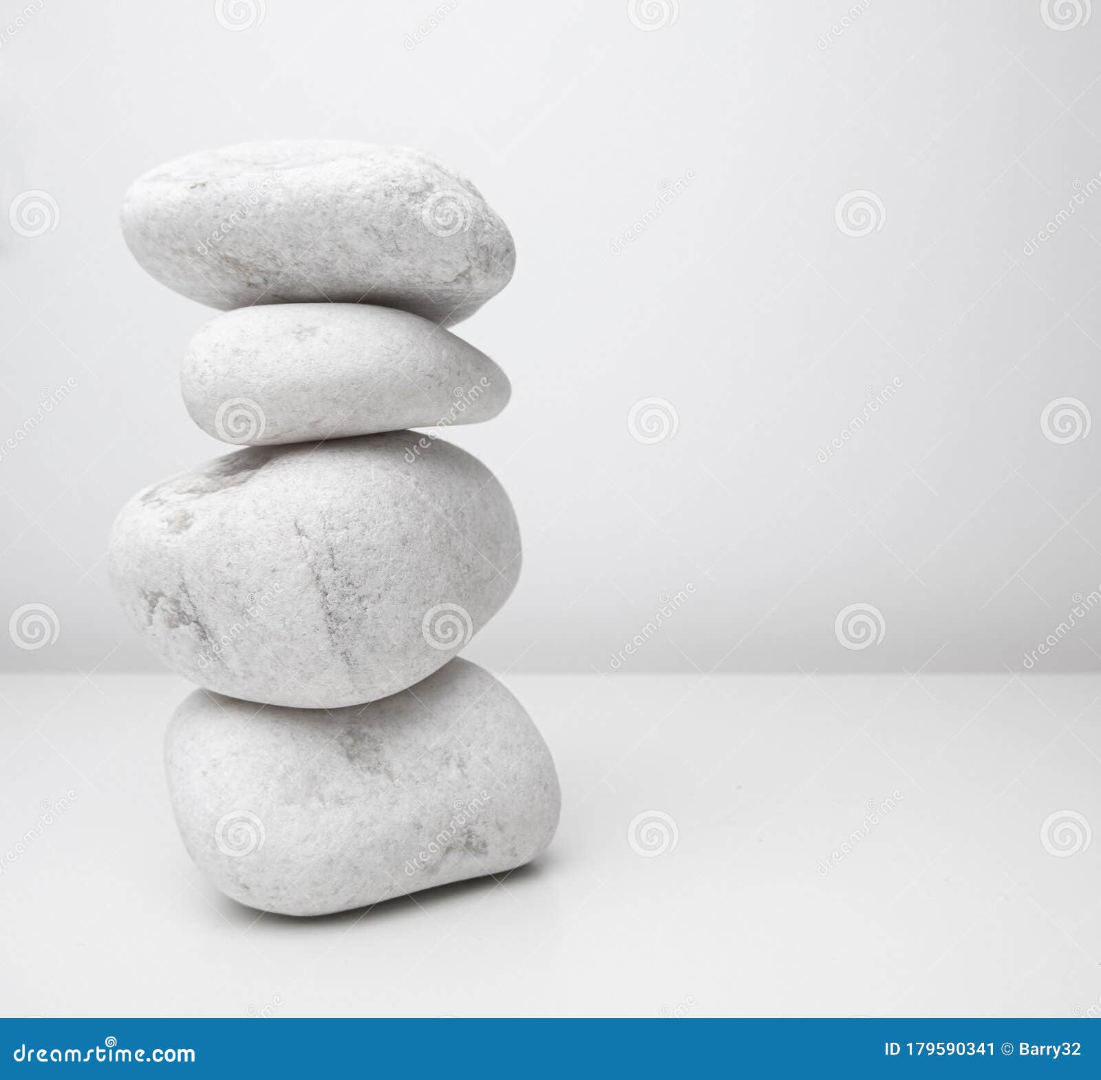 Tall Stack of White Stones on White Table Stock Image - Image of bright ...