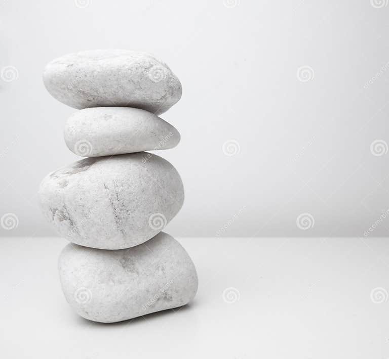 Tall Stack of White Stones on White Table Stock Image - Image of bright ...