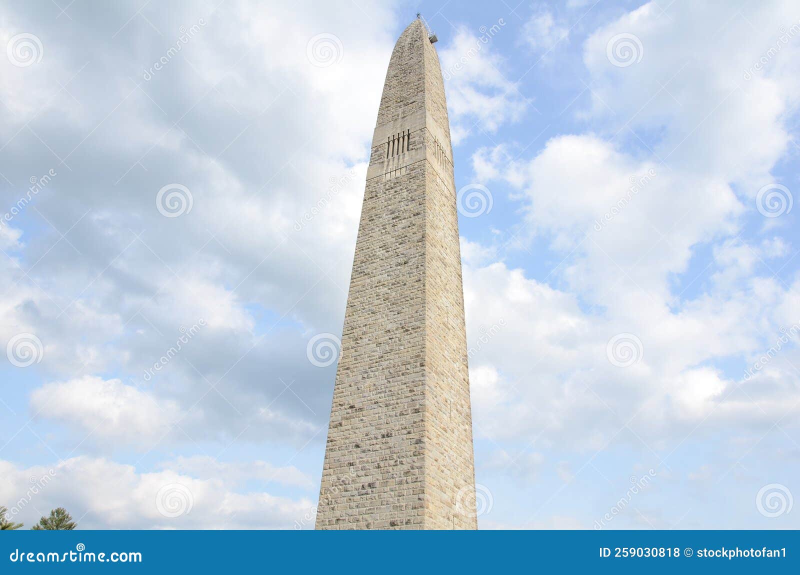 Tall Stone Building or Tower with Clouds in Sky Stock Photo - Image of ...
