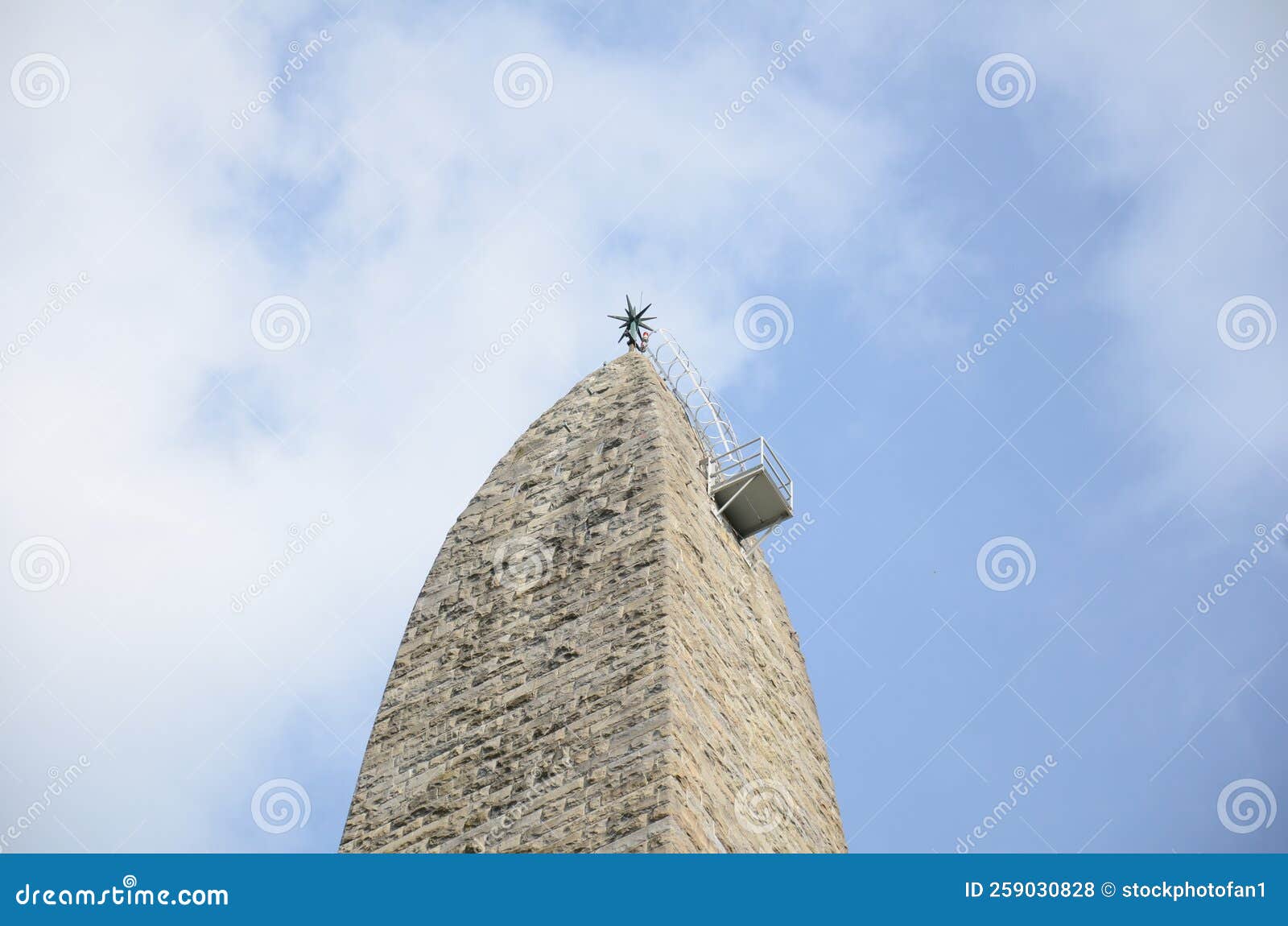 Tall Stone Building or Tower with Clouds in Sky Stock Photo - Image of ...