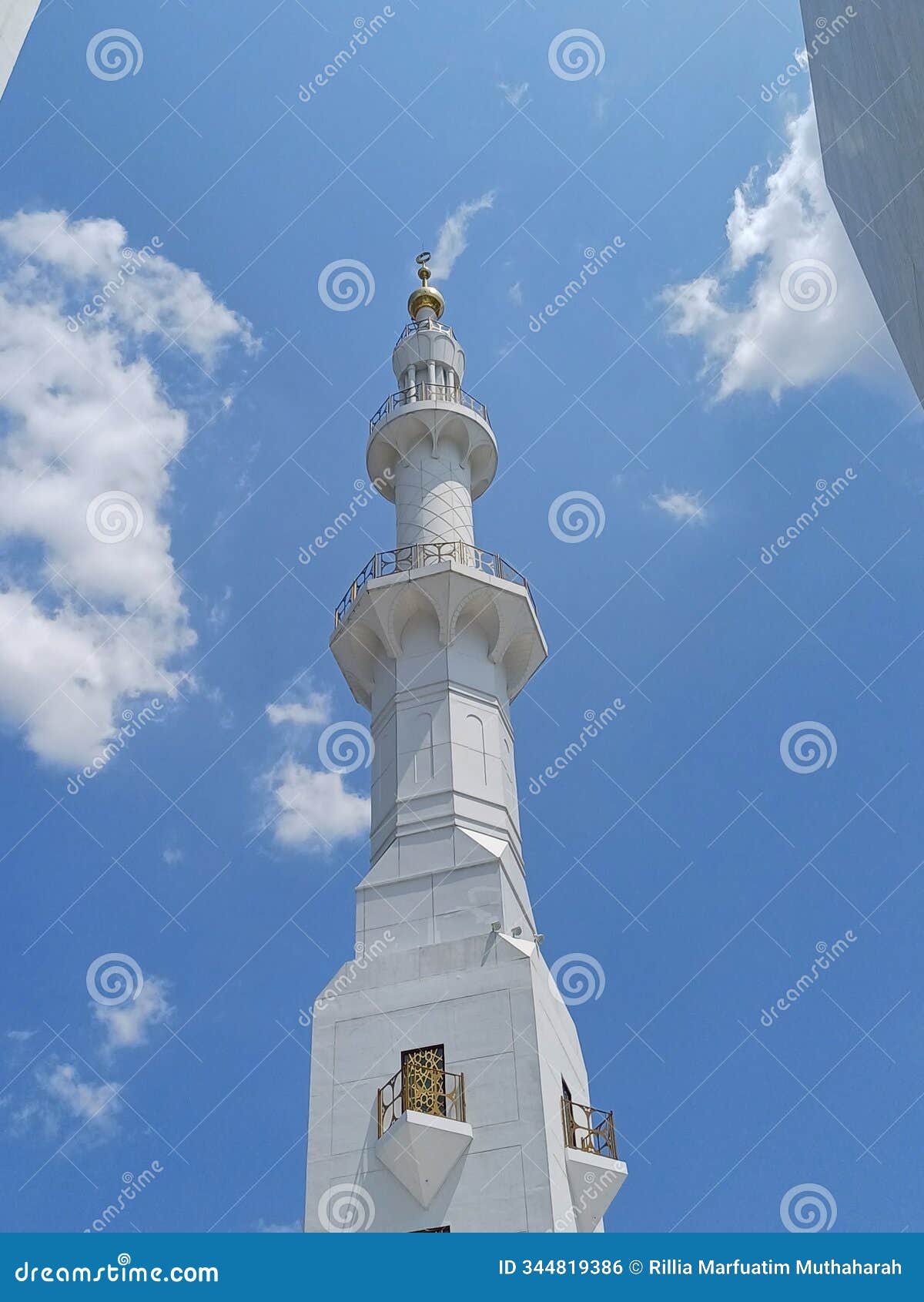 The Tall Tower of Mosque Against Blue Sky and Cloud Stock Photo - Image ...