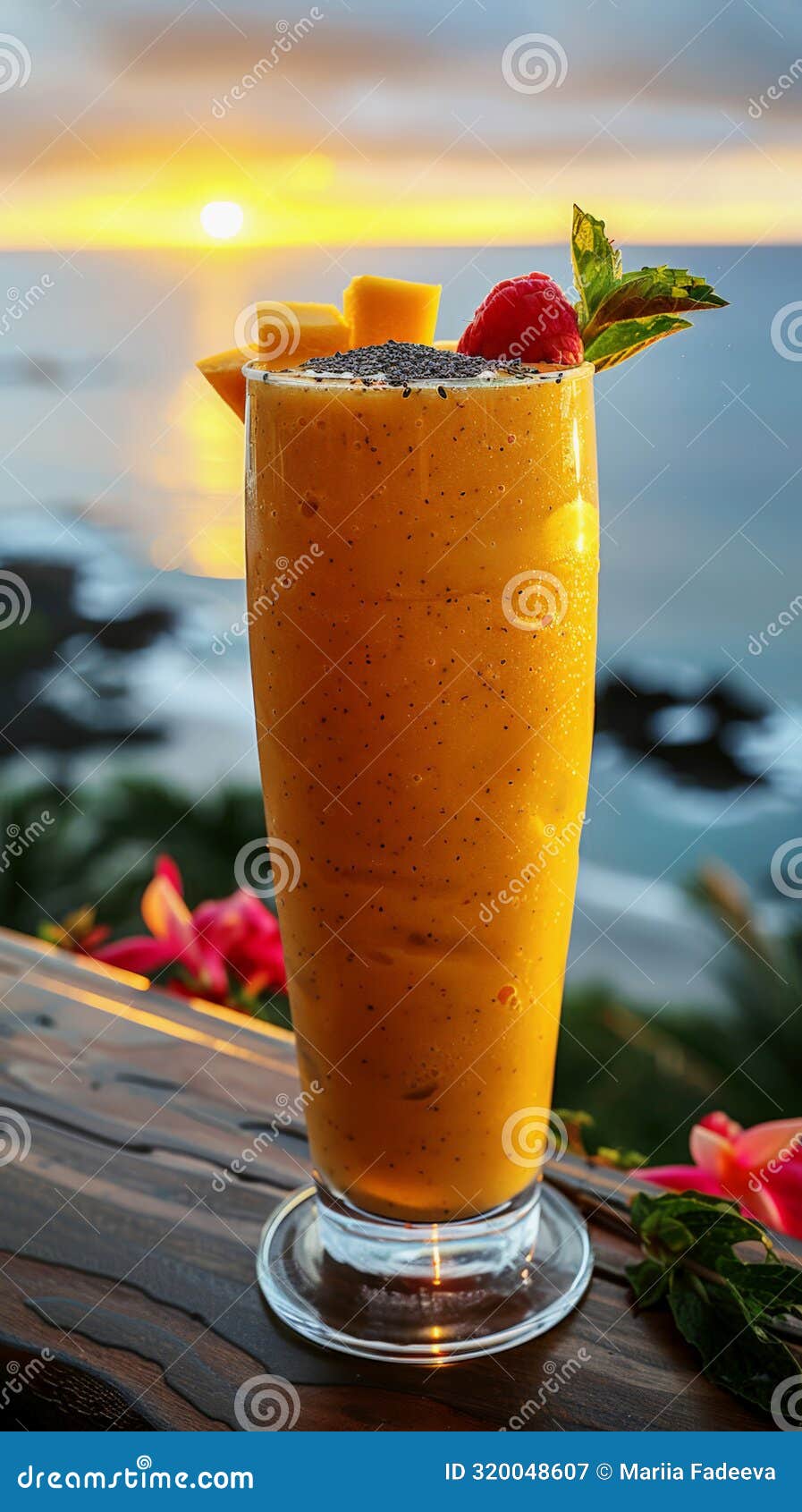 Tall Tropical Mango Smoothie with a Raspberry and Mint Garnish at ...