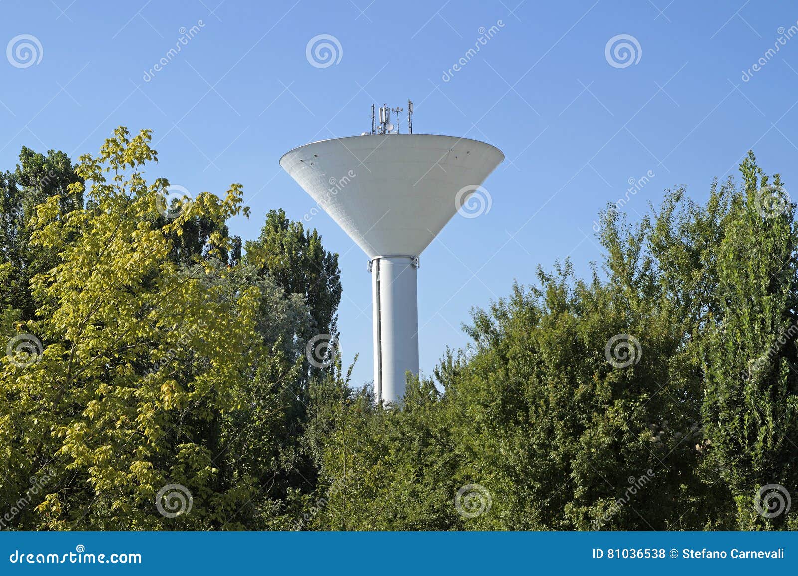 Tall Water Tower with Cloudy Blue Sky Background Stock Photo - Image of ...