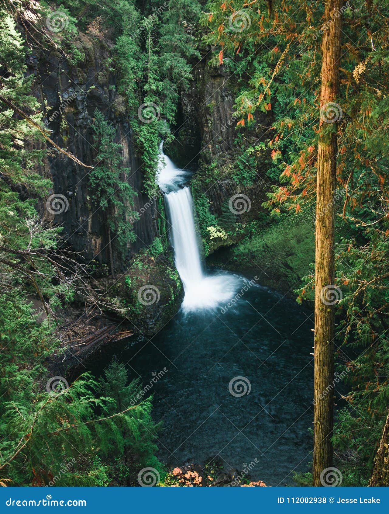 A Tall Waterfall Pours Over the Cliffs Stock Photo - Image of hiking ...
