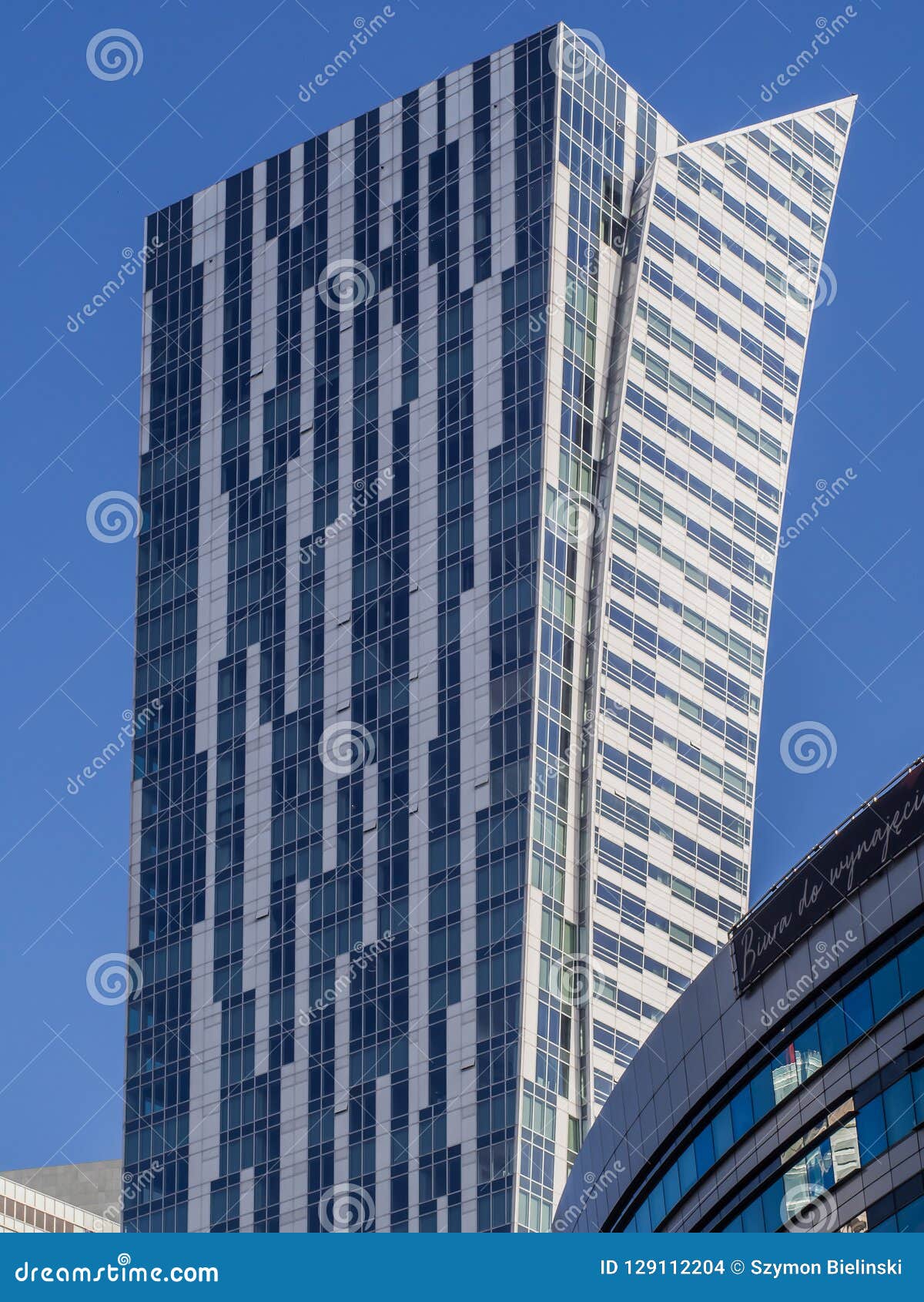 A Tall White-blue Building Against a Blue Sky Editorial Stock Image ...
