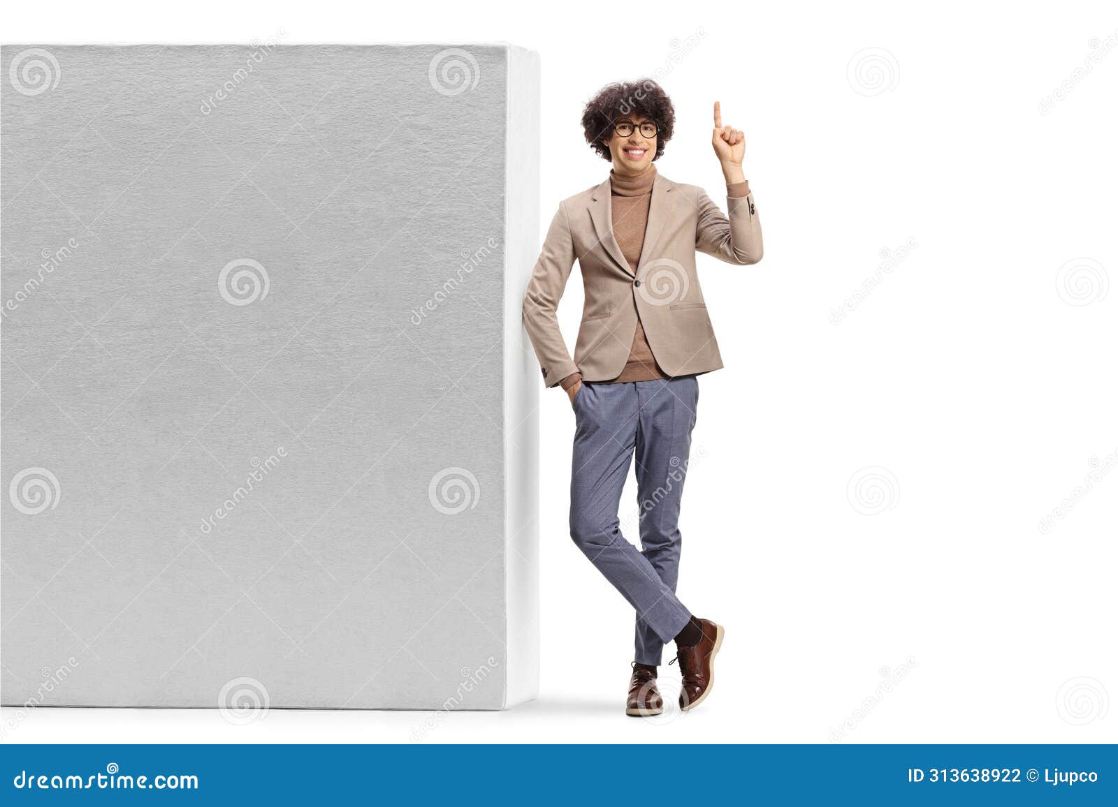 Tall Young Man Leaning on a Wall and Pointing Up Stock Photo - Image of ...