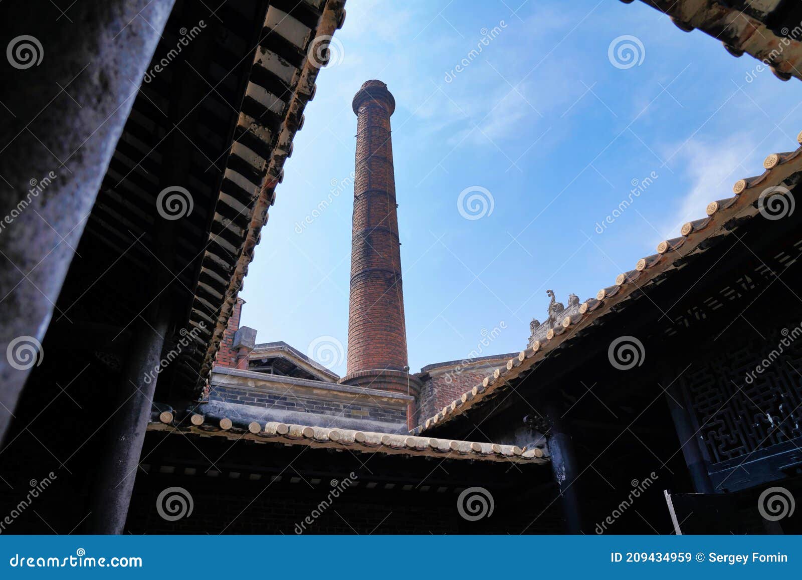 The Tallest Brick Tower between Buildings Stock Image - Image of ...