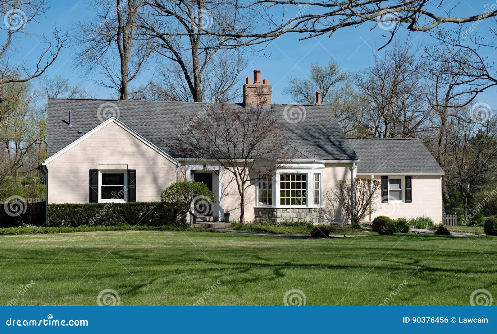 Tan Painted Brick House with Bay Window Stock Photo - Image of outdoors ...