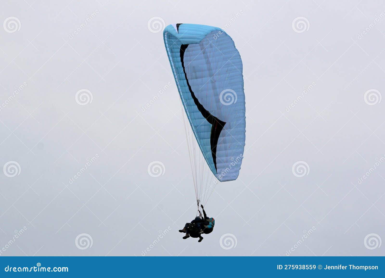 Tandem Paraglider Flying in a Cloudy Sky Stock Image - Image of ...