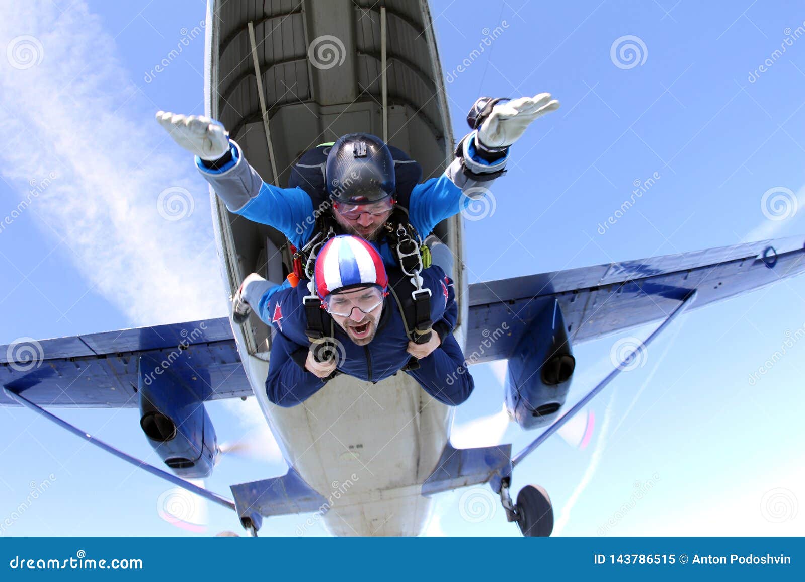 Tandem Skydiving. Two Guys are Having Fun in the Sky. Stock Image ...