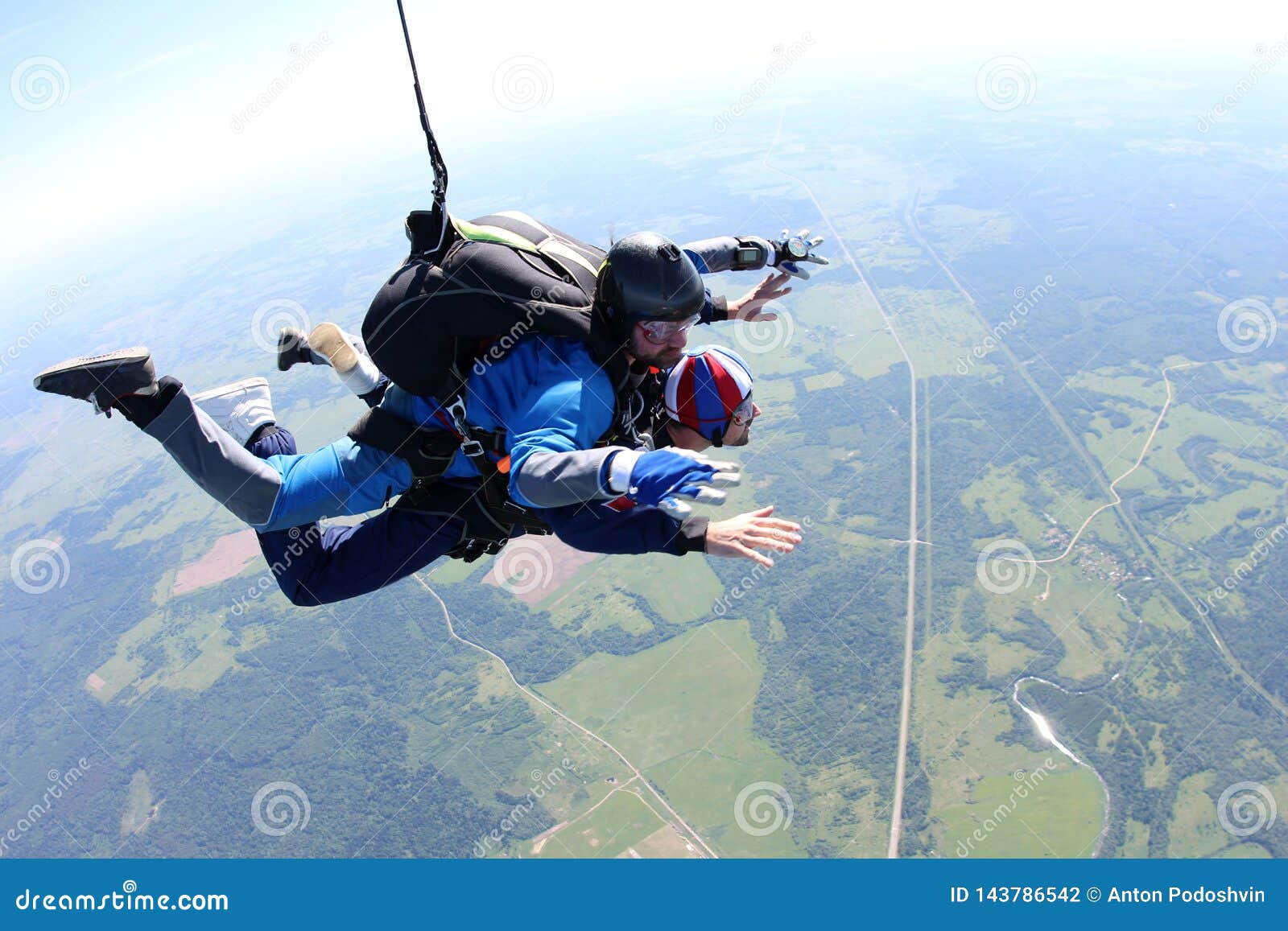 Tandem Skydiving. Two Guys are Having Fun in the Sky. Stock Photo ...