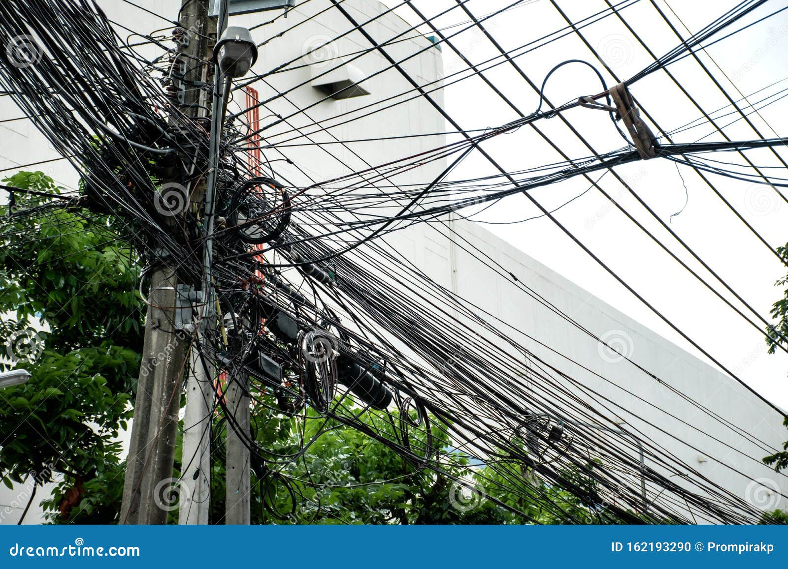 Tangle of Electrical Cables and Communication Wires on Electric Pole ...