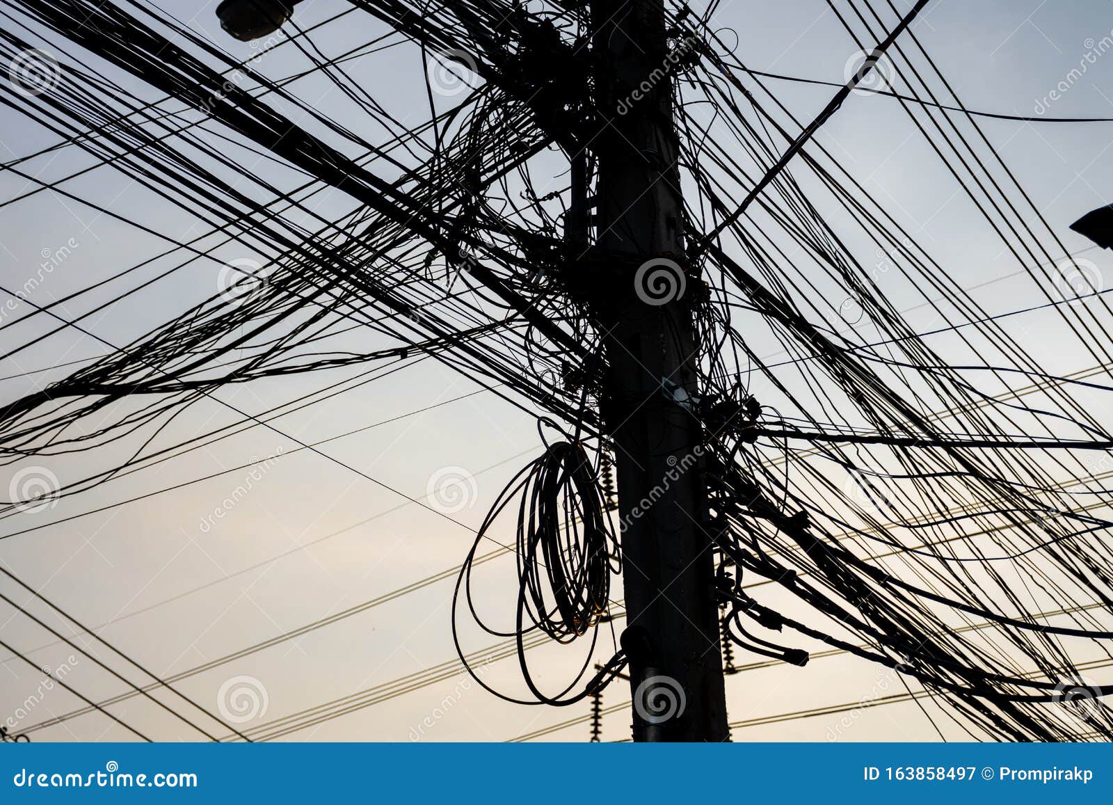 Tangle of Electrical Cables and Communication Wires on Electric Pole ...