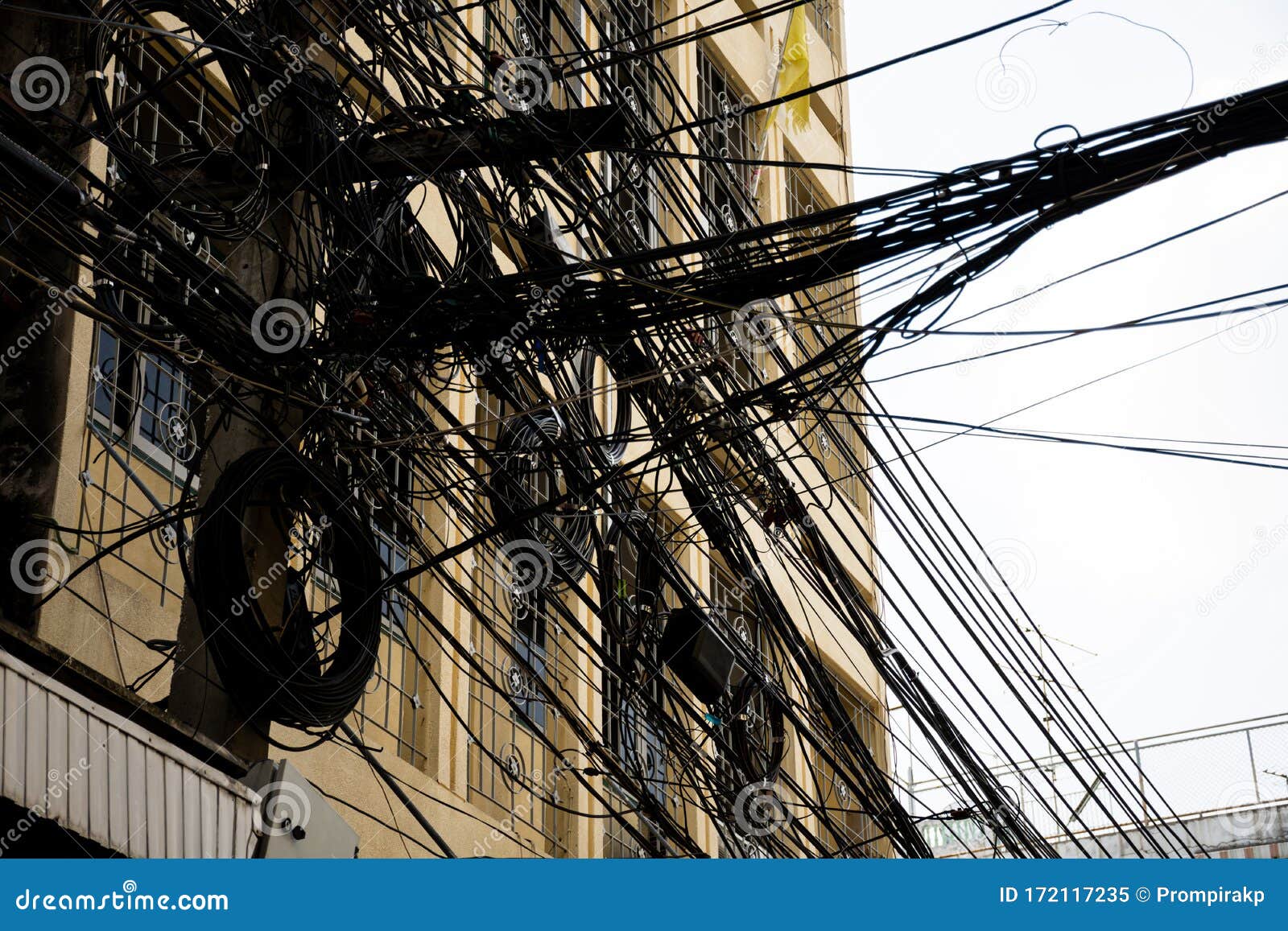 Tangle of Electrical Cables and Communication Wires on Electric Pole ...