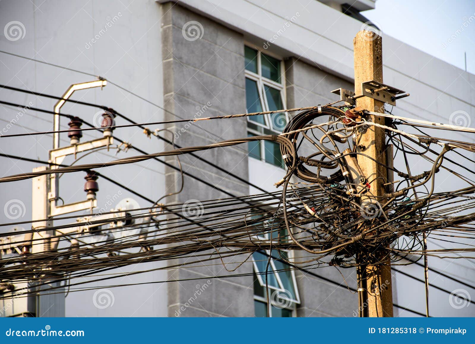 Tangle of Electrical Cables and Communication Wires on Electric Pole ...