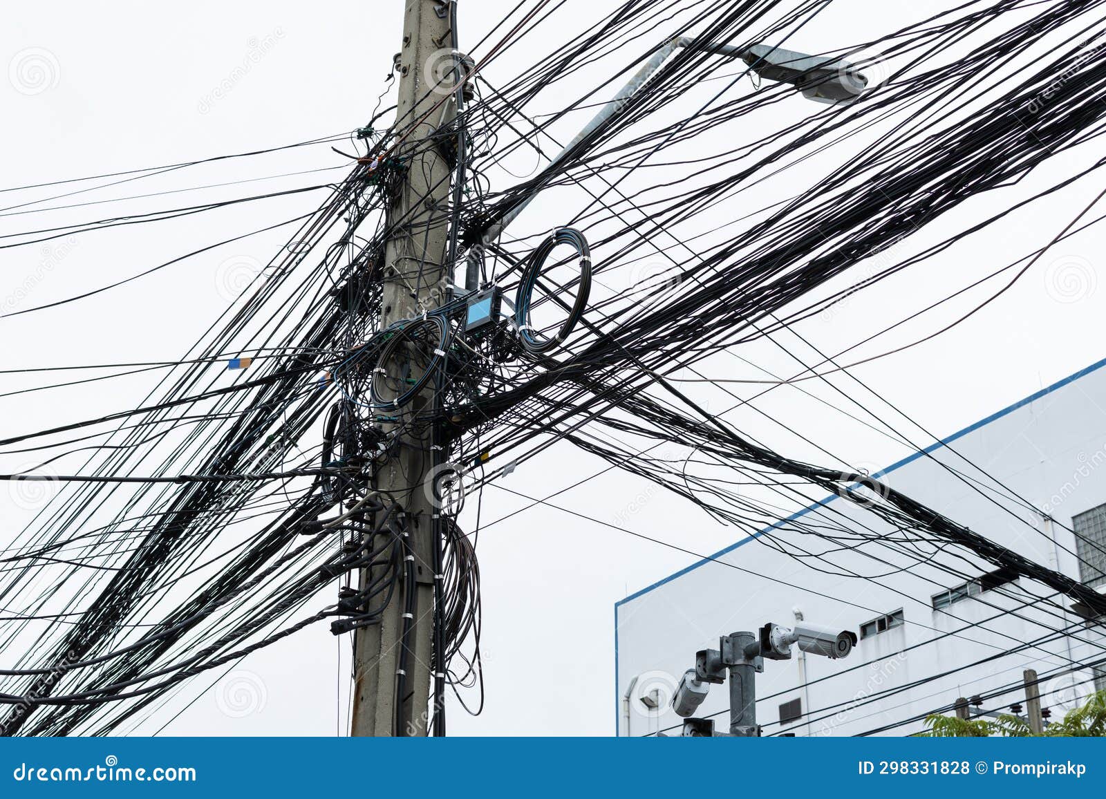 Tangle of Electrical Cables and Communication Wires on Electric Pole ...