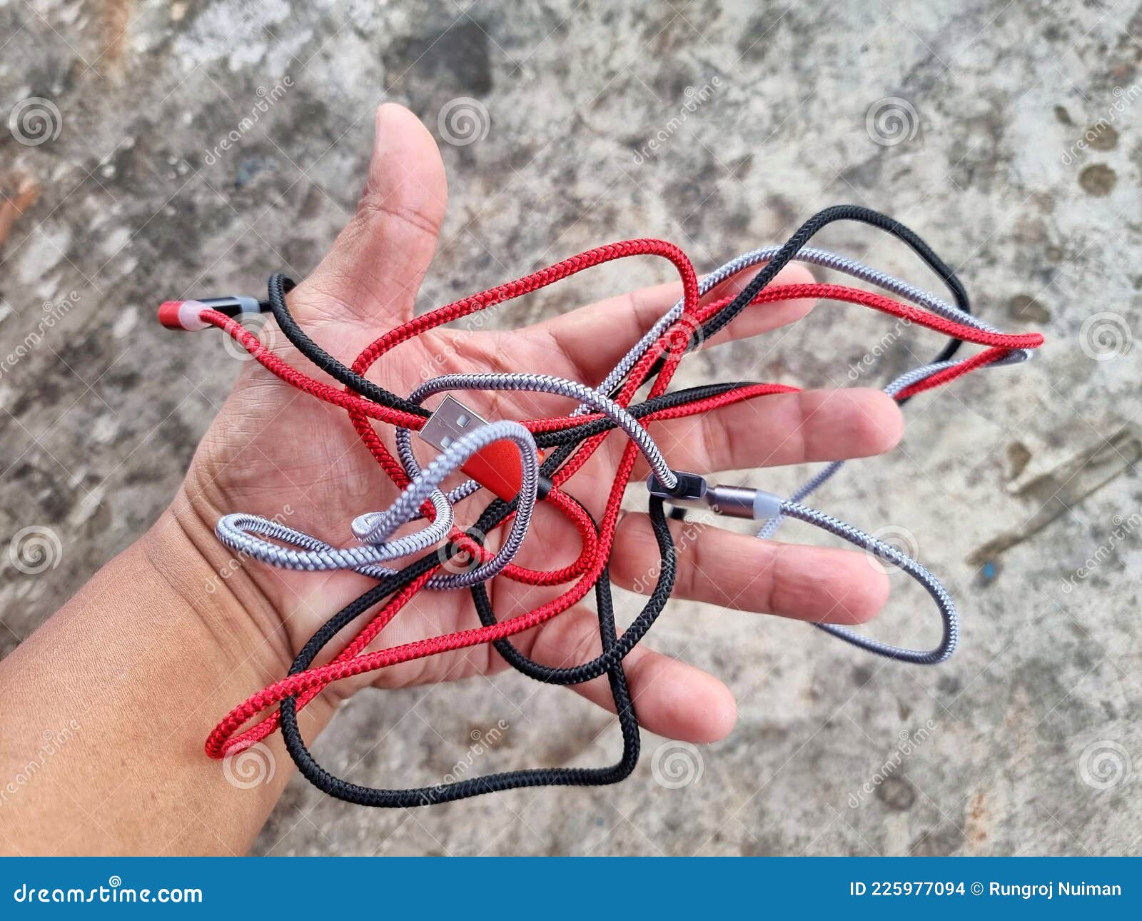 Tangled Cell Phone Charger Cable in the Hand Stock Photo - Image of ...