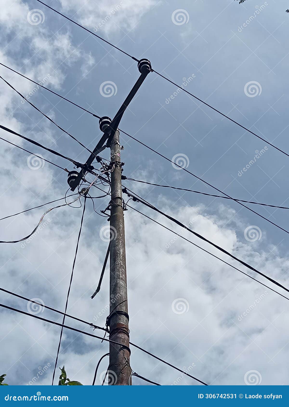 Tangled electricity poles stock image. Image of broken - 306742531