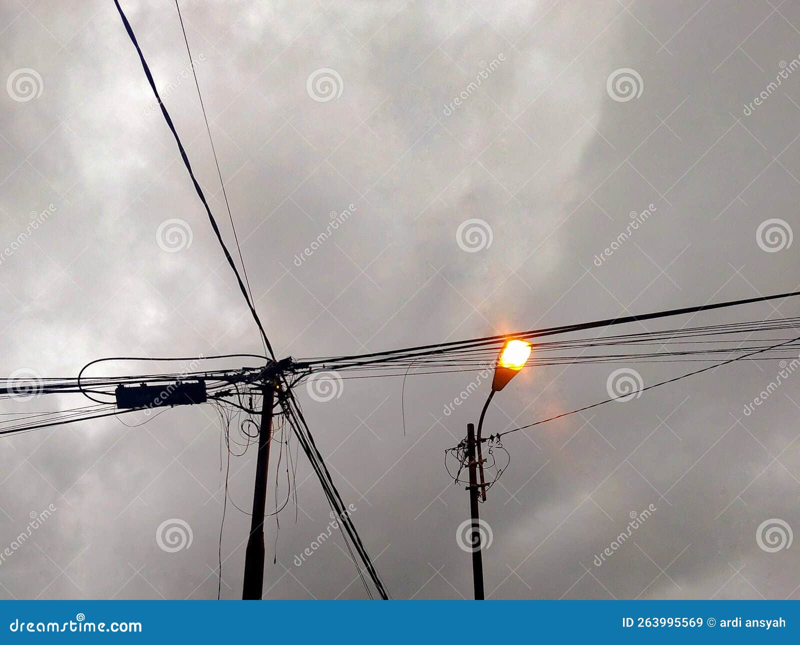 Tangled Fiber Optic Cable Wire and Street Light on Electrical Pole ...