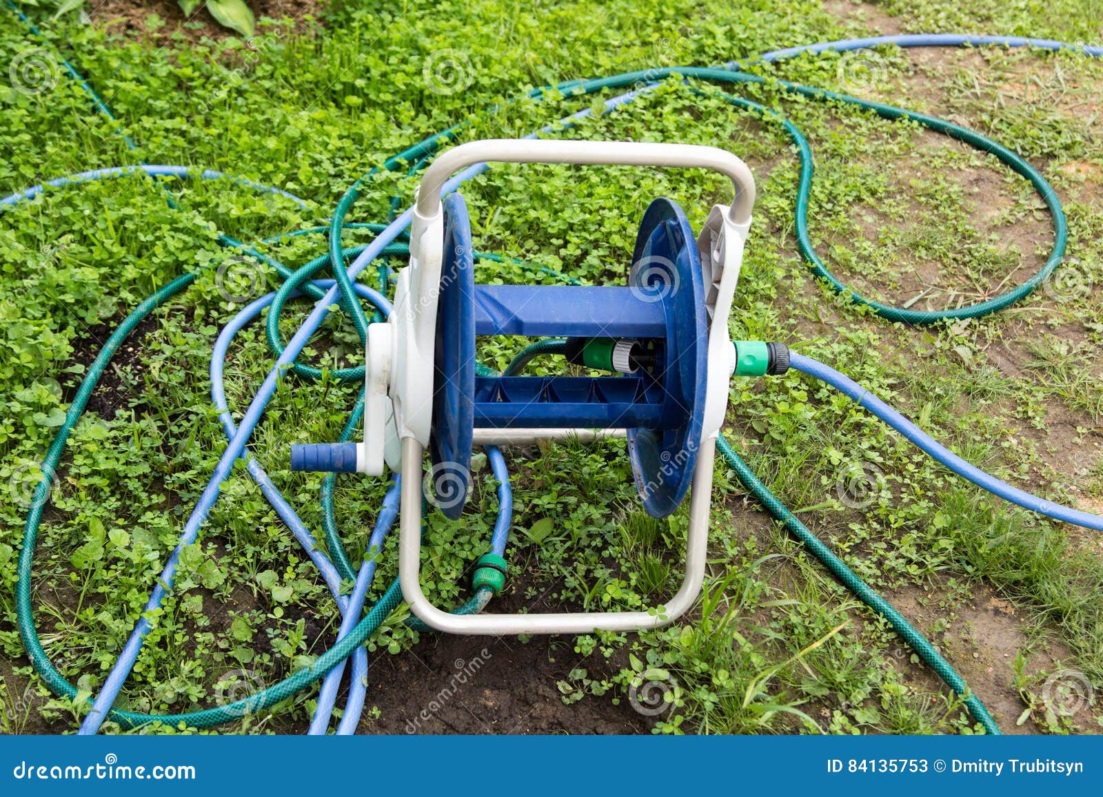Tangled Garden Hose With A Reel On Grass Royalty-Free Stock Photo ...