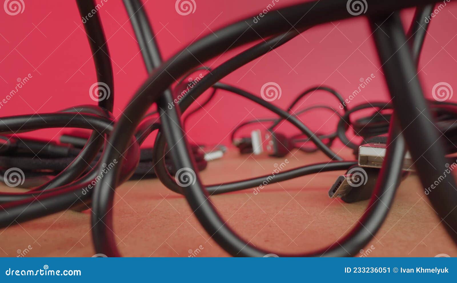 Tangled Wires of USB Cables Lie on Table on Pink Background Stock Video ...