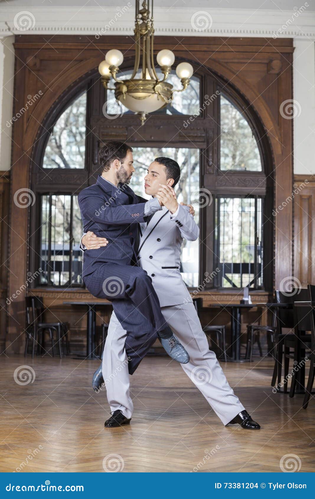 Tango Dancer Lifting Male Partner in Restaurant Stock Photo - Image of ...