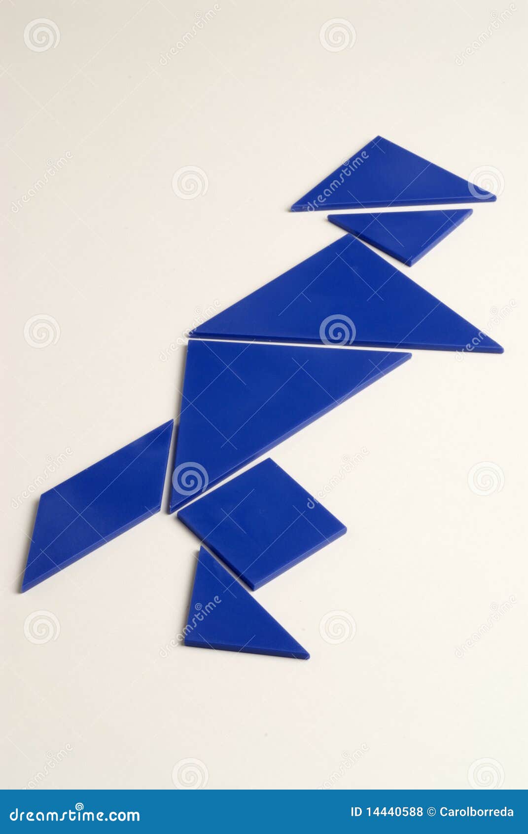 Tangram Puzzle In Parallelogram Shape On Wood Background Stock Photo ...