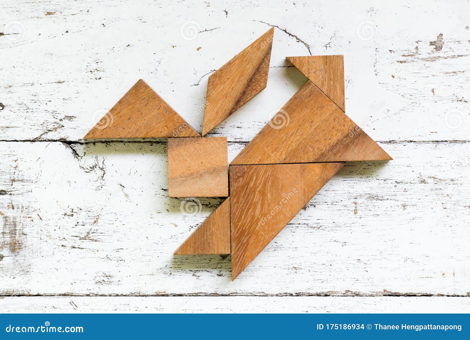 Tangram Puzzle in Jumping Rabbit Shape on White Wood Background Stock ...