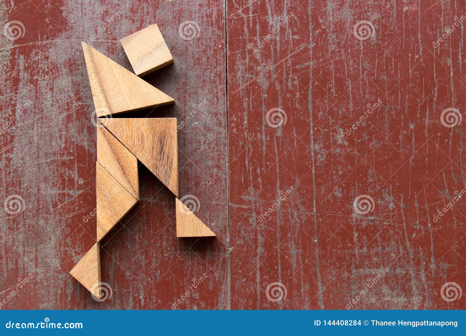 Tangram Puzzle in Man Dancing with Fun Shape on Red Wood Background ...