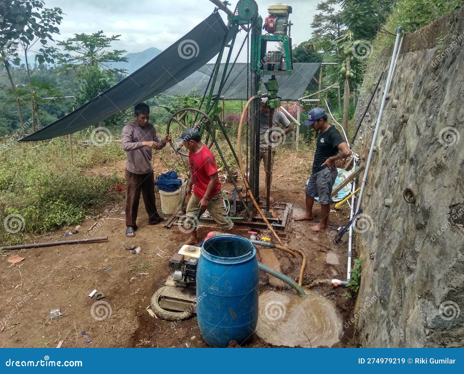Four Workers are Carrying Out a Project To Drill the Ground Editorial ...