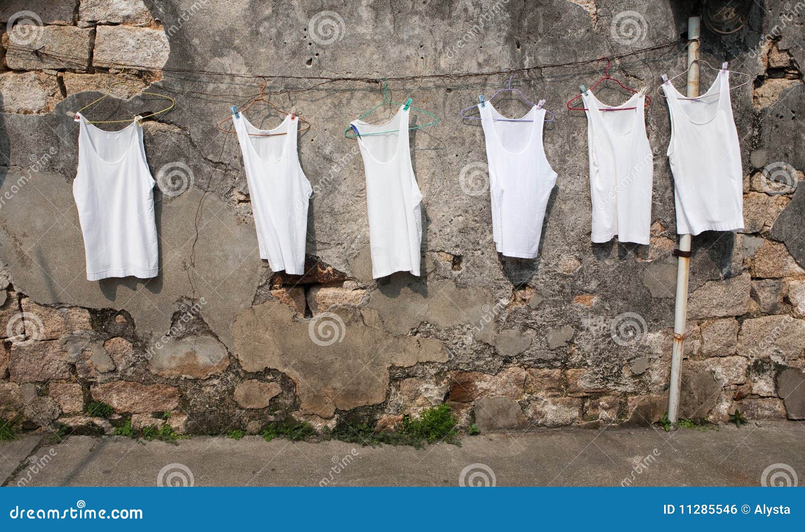 Tank Undershirts Drying in the Sun Stock Photo - Image of tank, drying ...