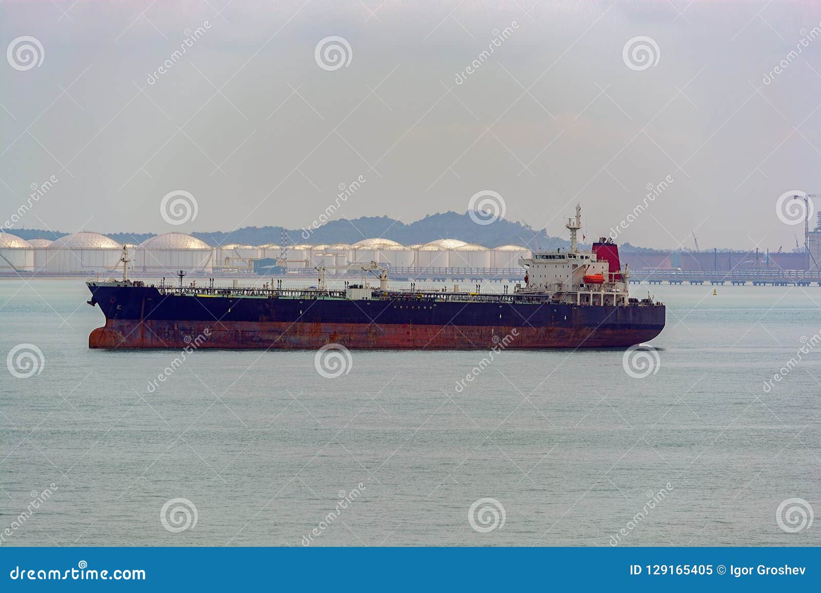 Tanker in Front of an Oil Storage Terminal Stock Image - Image of ship ...