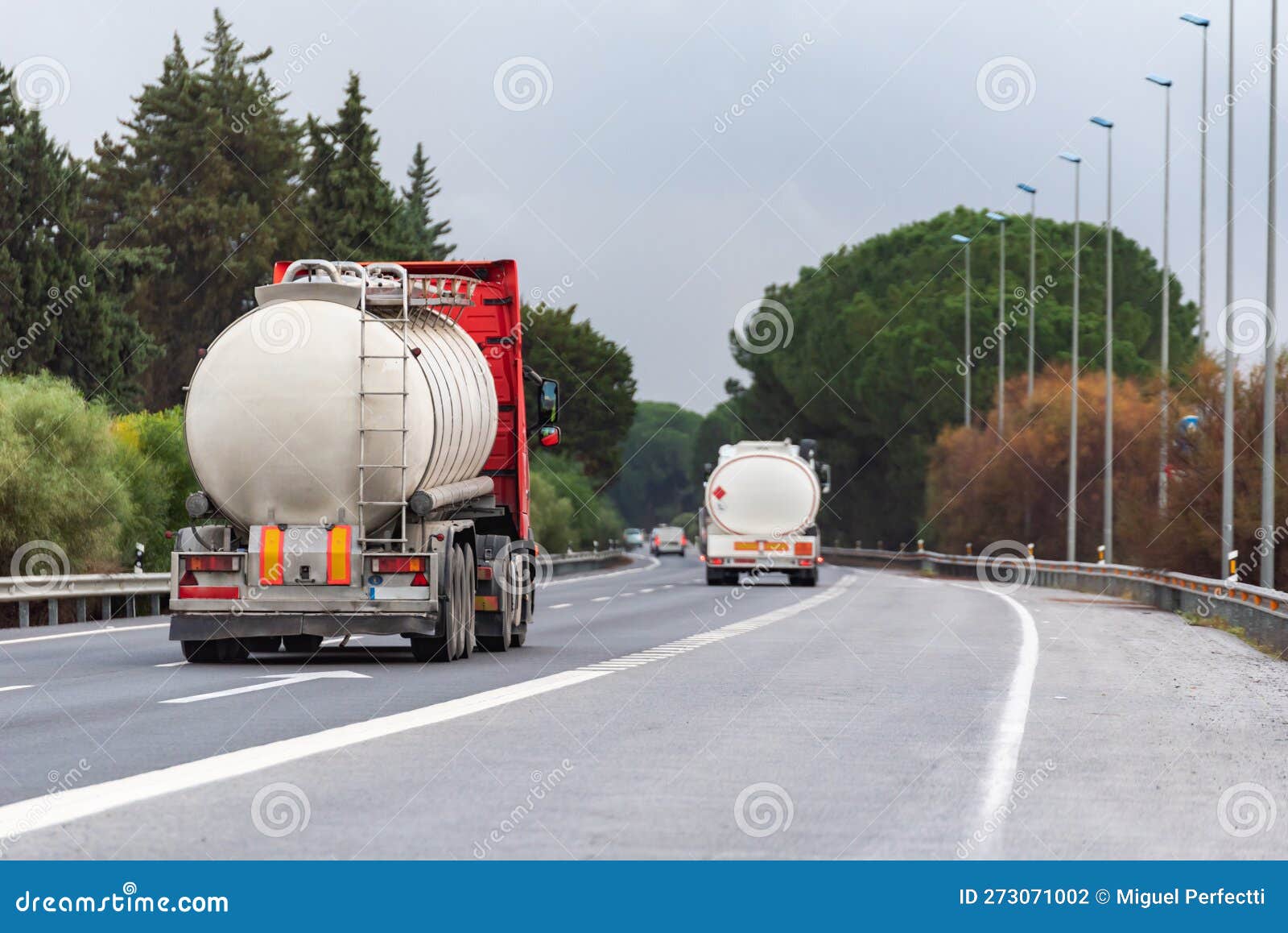 Tanker Trucks Driving on a Highway, Rear View Stock Photo - Image of ...