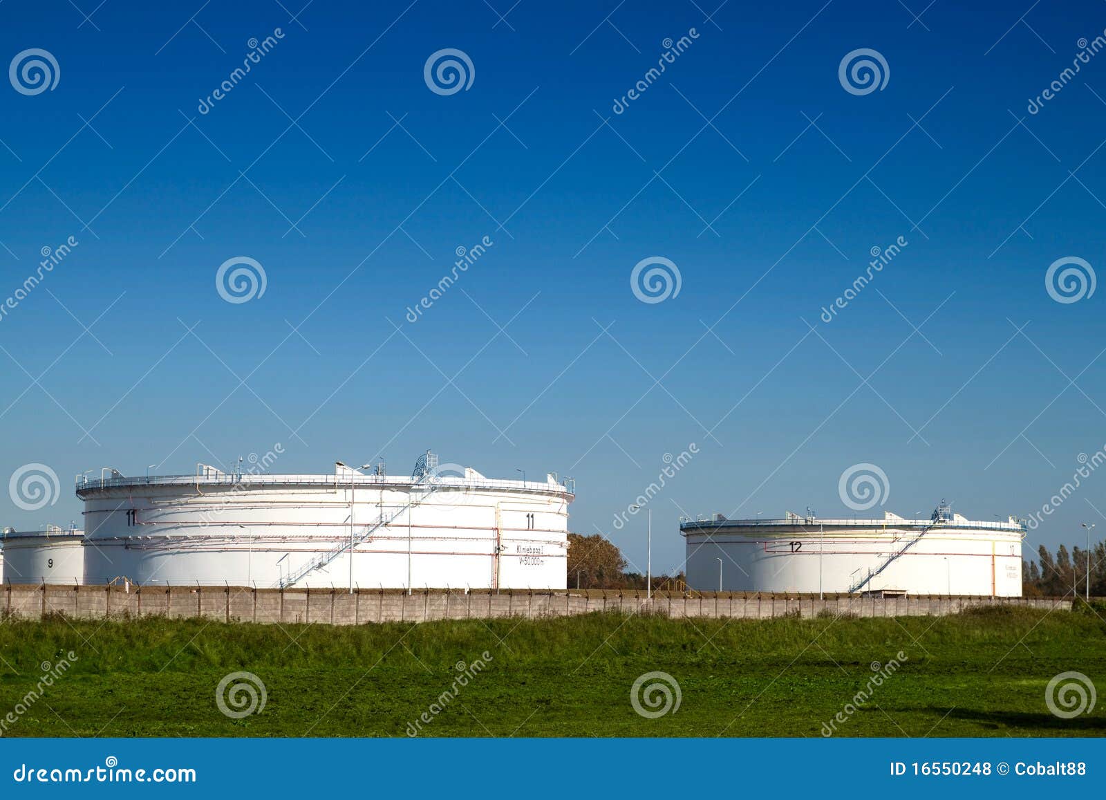 The Huge Petrol Oil Tanks With Stairs Exterior In Refinery Indus Stock ...