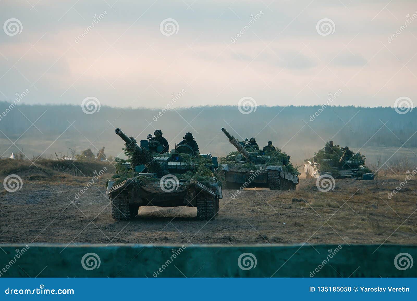 Tanks in Row Masked at Pine Tree Branches in Polygon Stock Photo ...