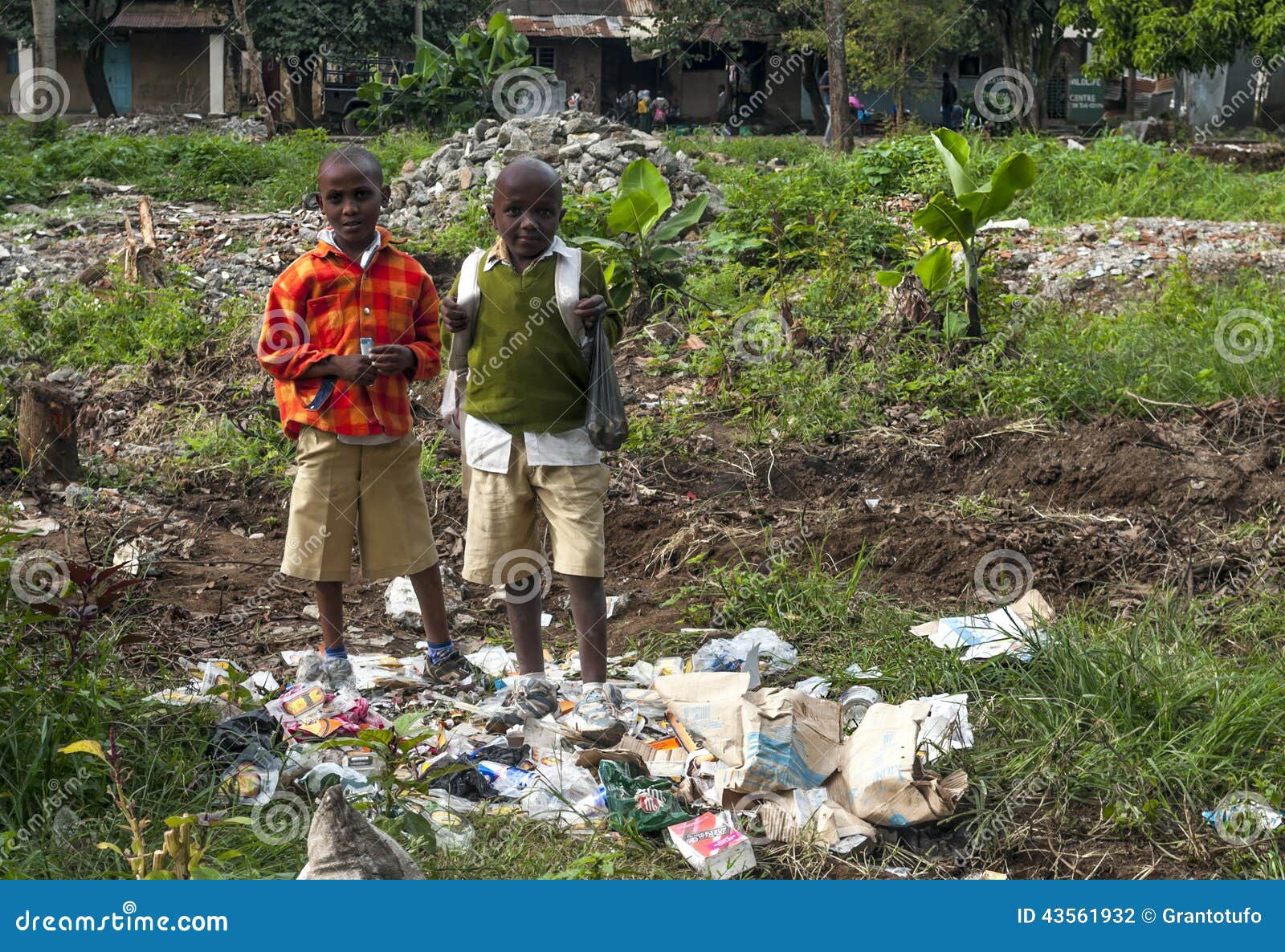 Tanzanian boys in garbage editorial photography. Image of fruits - 43561932