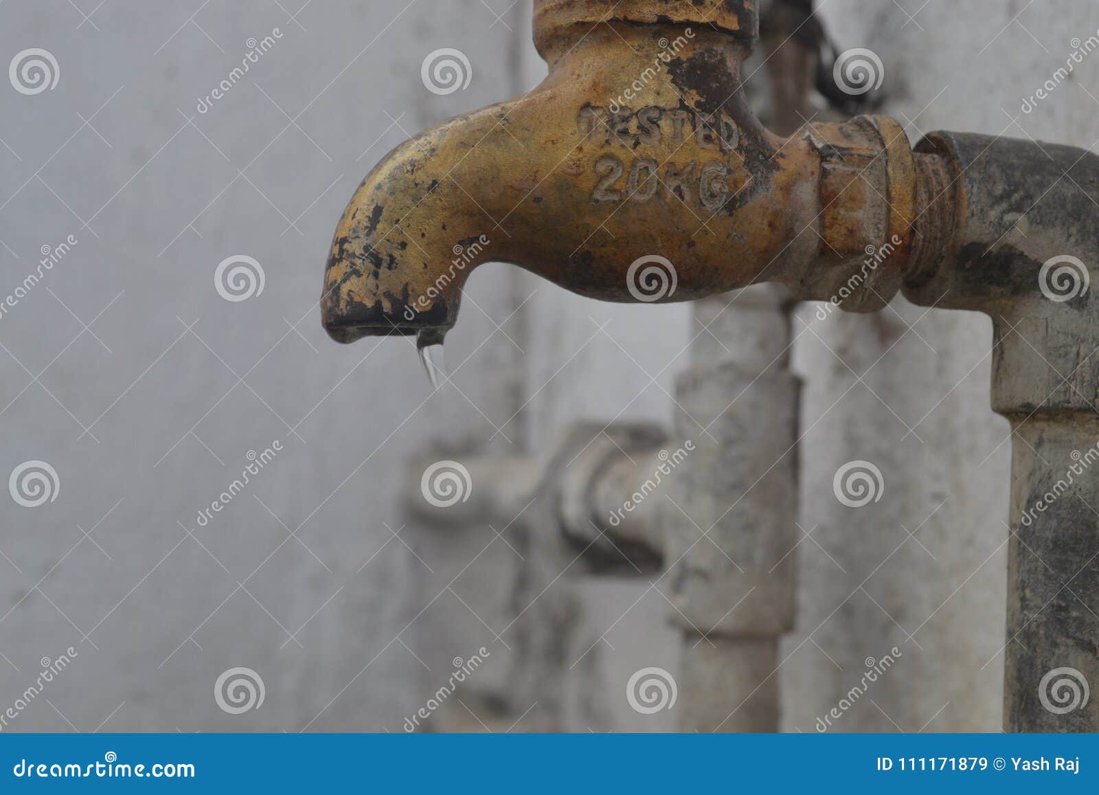 Portrait of tap drop. stock image. Image of showing - 111171879